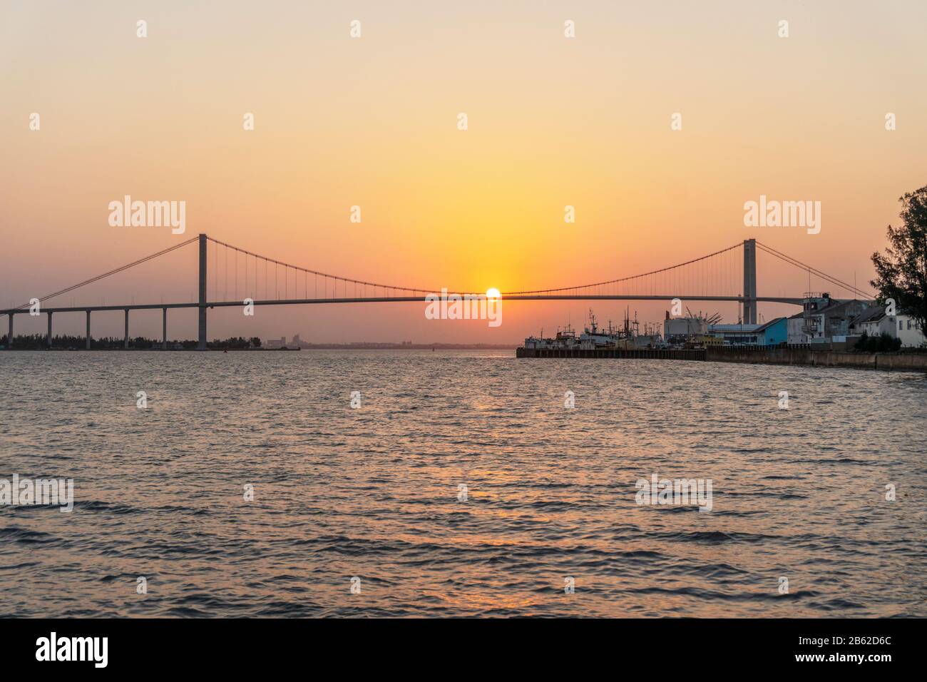 Sun hanging on The Golden Bridge in Maputo, Mozambique Stock Photo - Alamy
