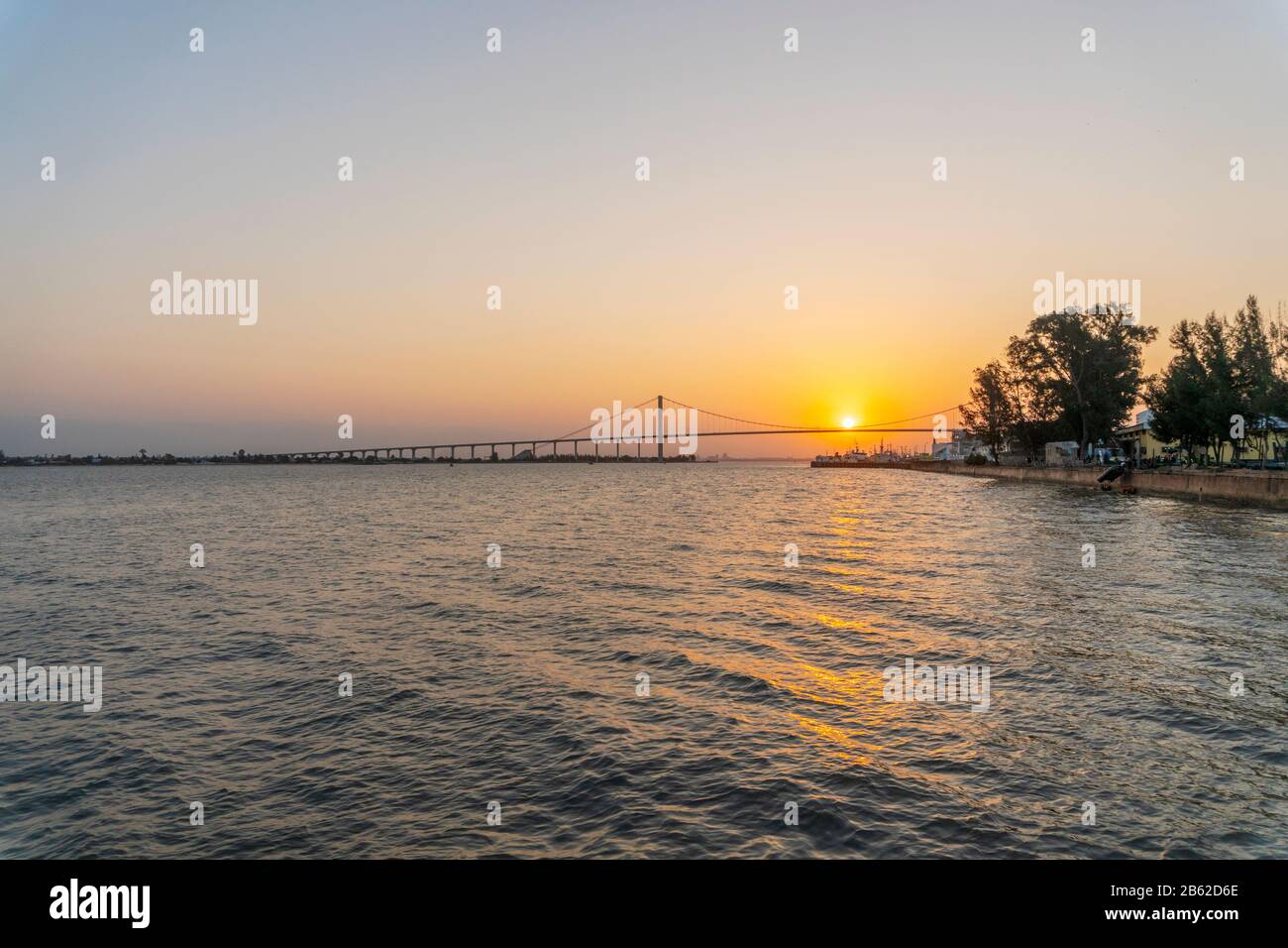 Sun hanging on The Golden Bridge in Maputo, Mozambique Stock Photo - Alamy