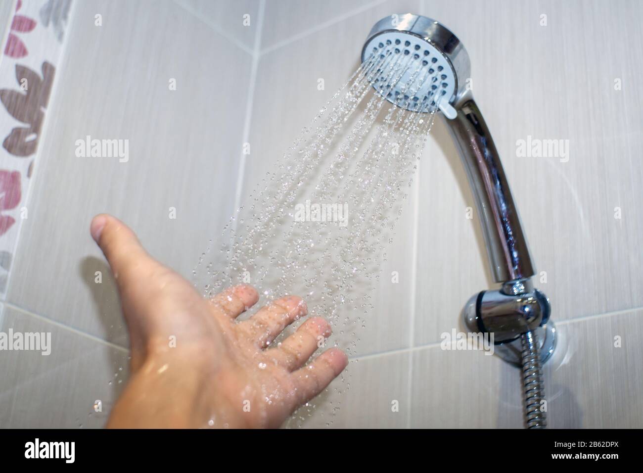 Hand check temperature water hi-res stock photography and images - Alamy