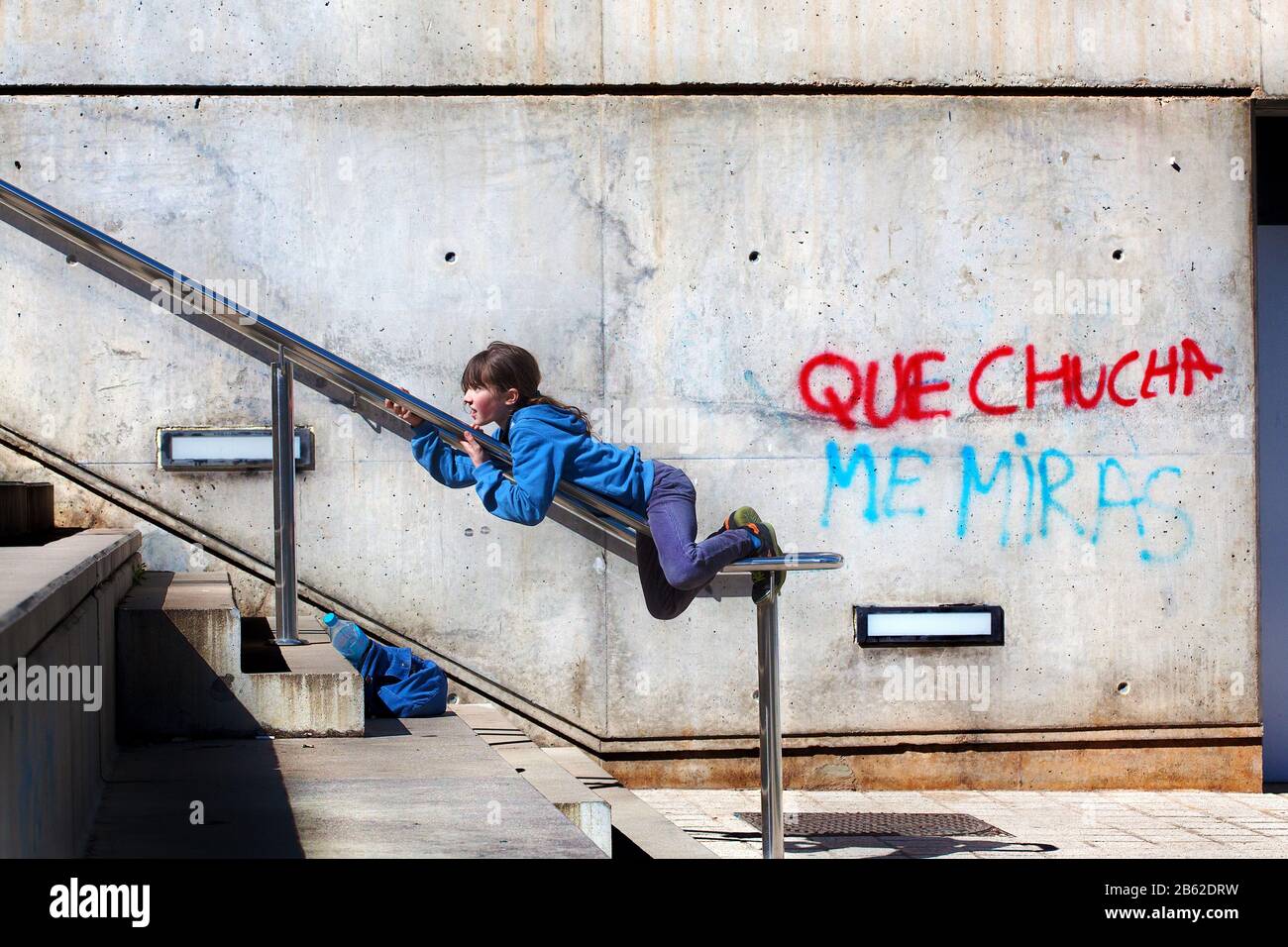 Boy sliding up hand rails, Barcelona, Spain Stock Photo - Alamy