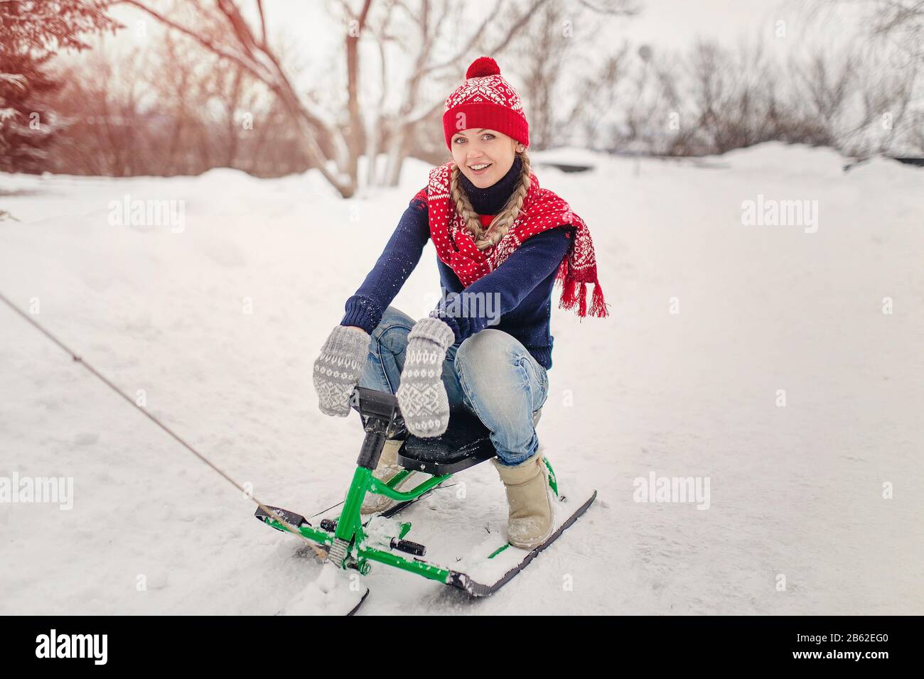 Girl On Snowmobile High Resolution Stock Photography and Images - Alamy