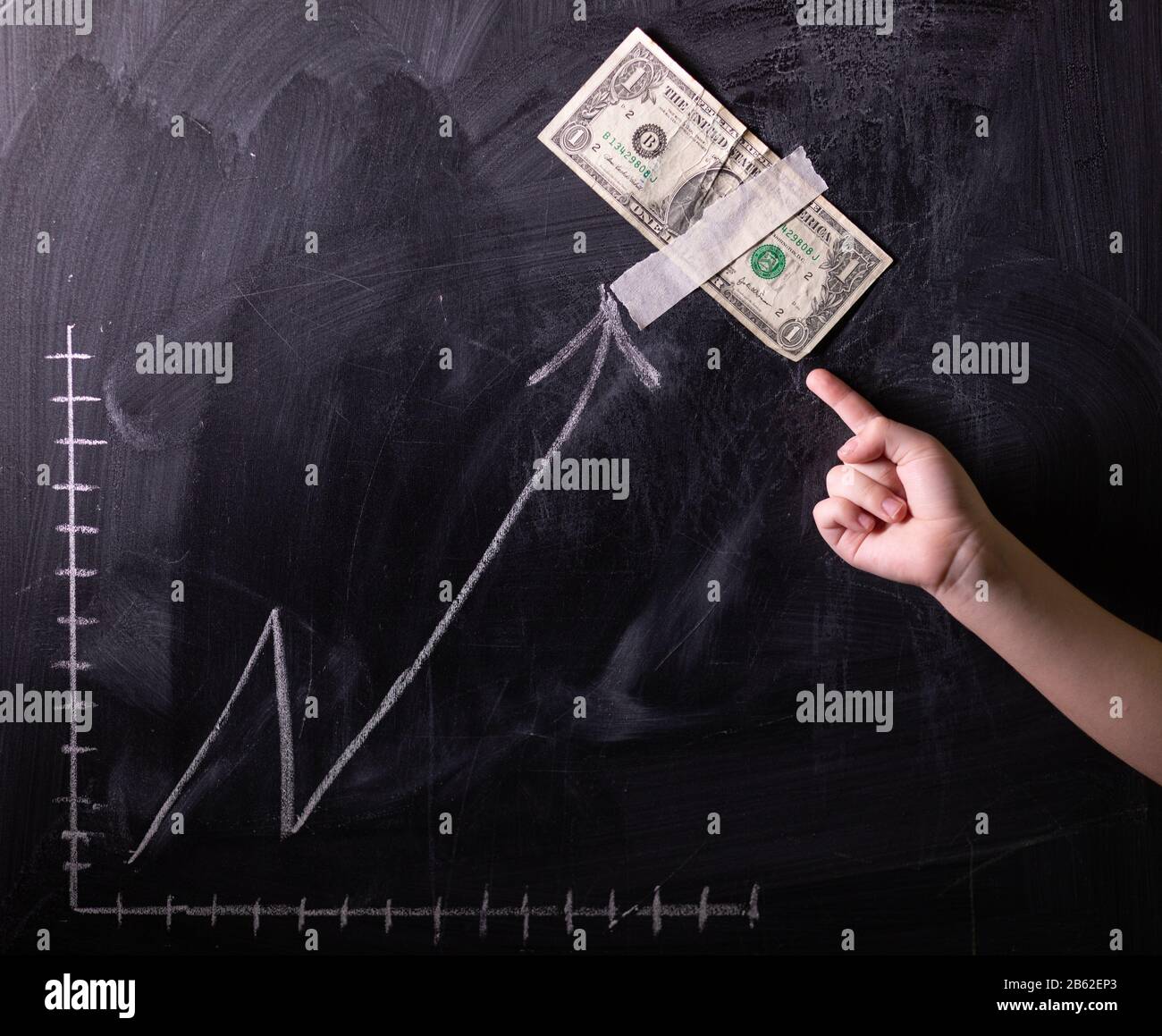 Dollar growth chart drawn on chalkboard. Investment concepts and ...