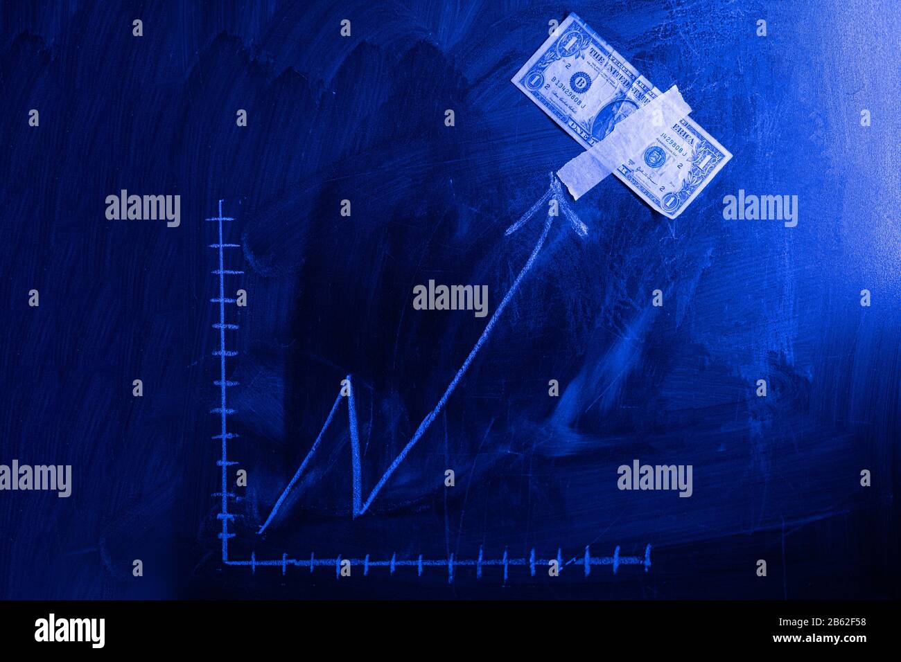 Dollar growth chart drawn on chalkboard. Investment concepts and ...