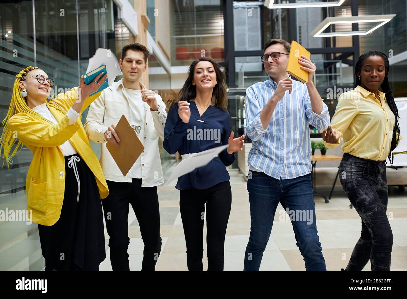 funny happy office workers throwing documents, paper, celebrating ...