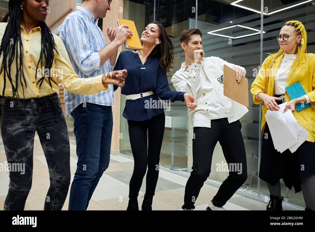 mad crazy team celebrating their successddful deal, disco at the office ...