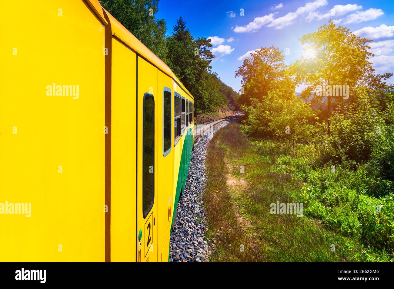 Train ride, view from a window. Old train passing green vegetation ...
