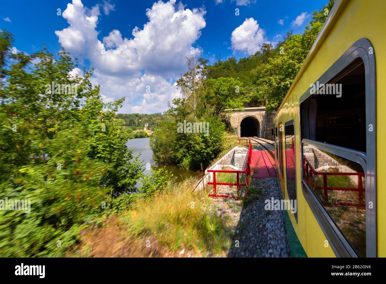 Train ride, view from a window. Old train passing green vegetation ...