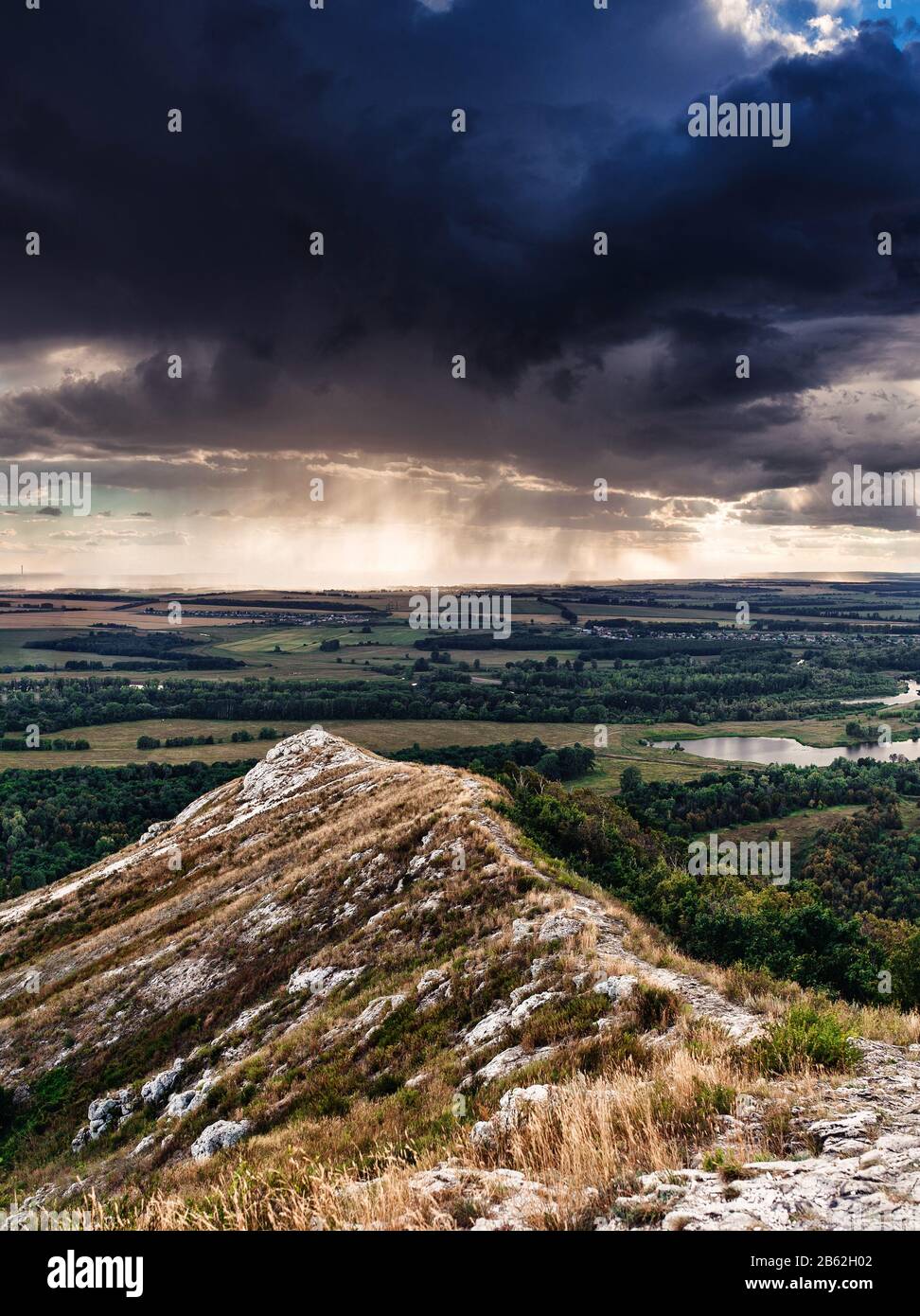 On the slope of a hilly ridge, the storm is coming from the side of the ...