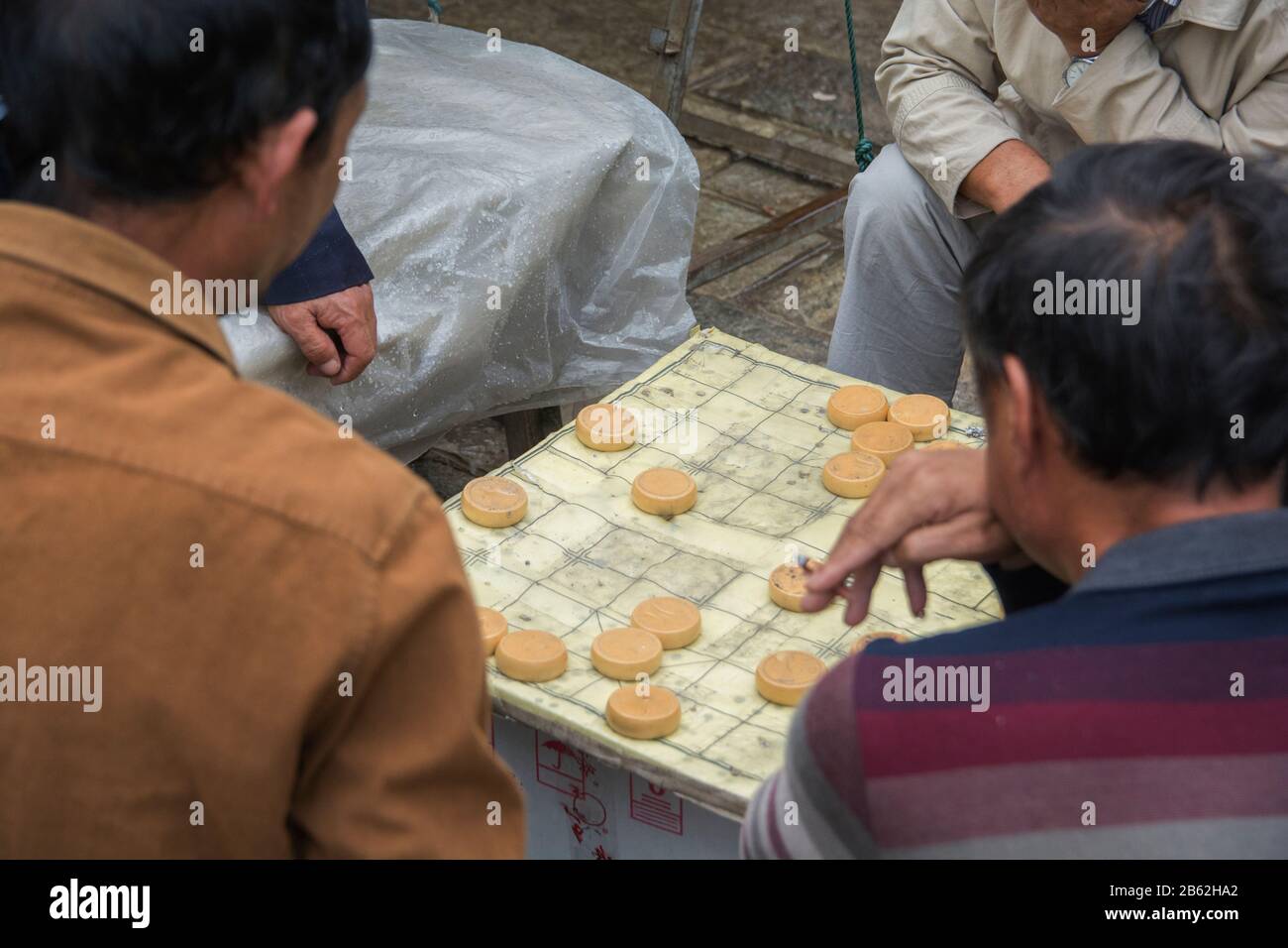 Chinese men playing "Xiangqi", also known as "Chinese Chess", a popular ...