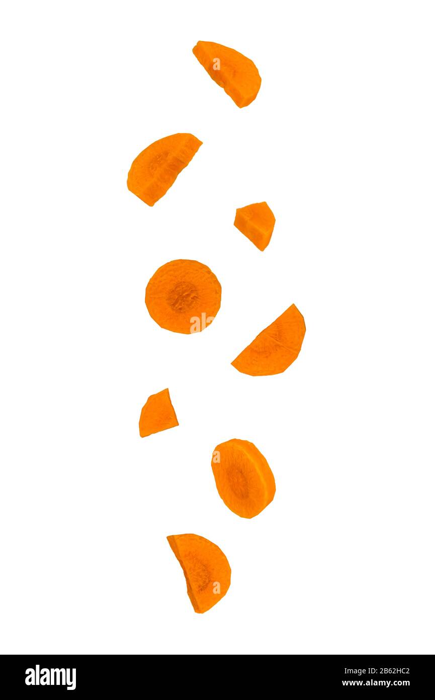 Isolated falling vegetables. Falling carrots isolated on white ...