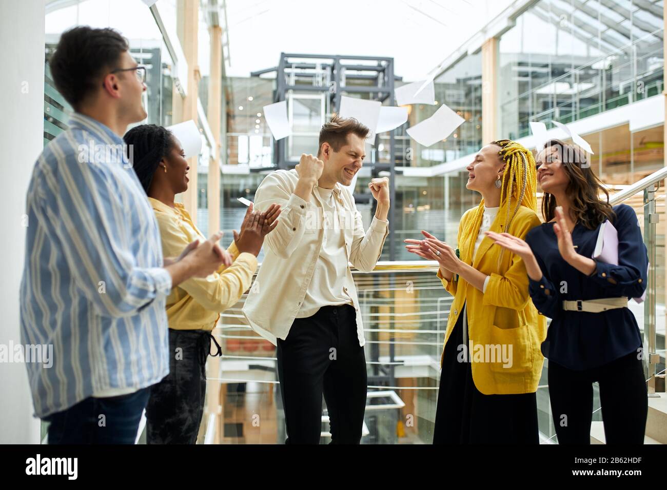 Cheerful young people coworkers dancing hi-res stock photography and ...