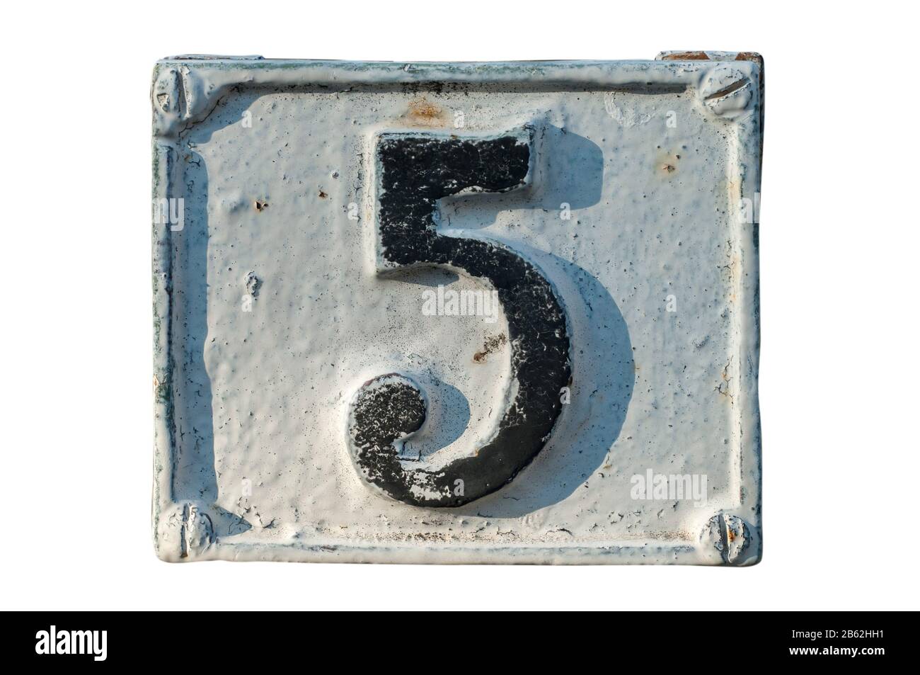 Old retro weathered cast iron plate with street number 5 closeup ...