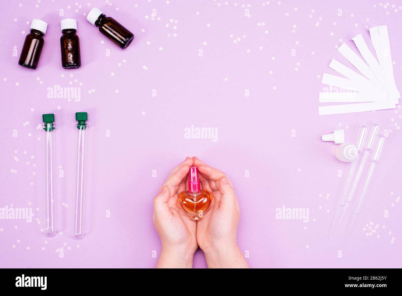 Making perfumes at home. Children's art project. Children's hands make ...