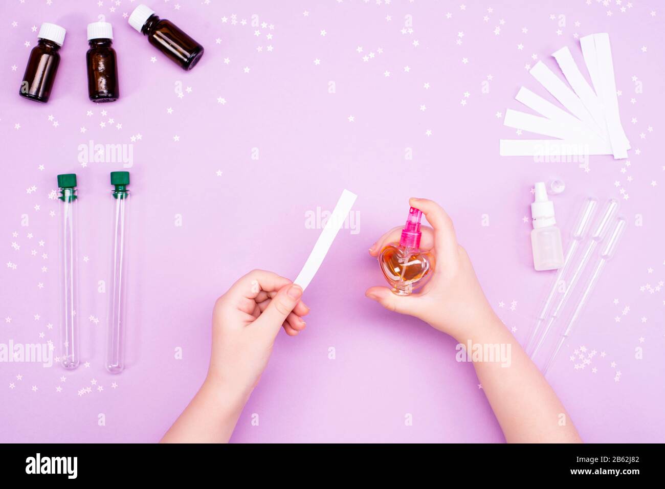 Making perfumes at home. Children's art project. Children's hands make ...