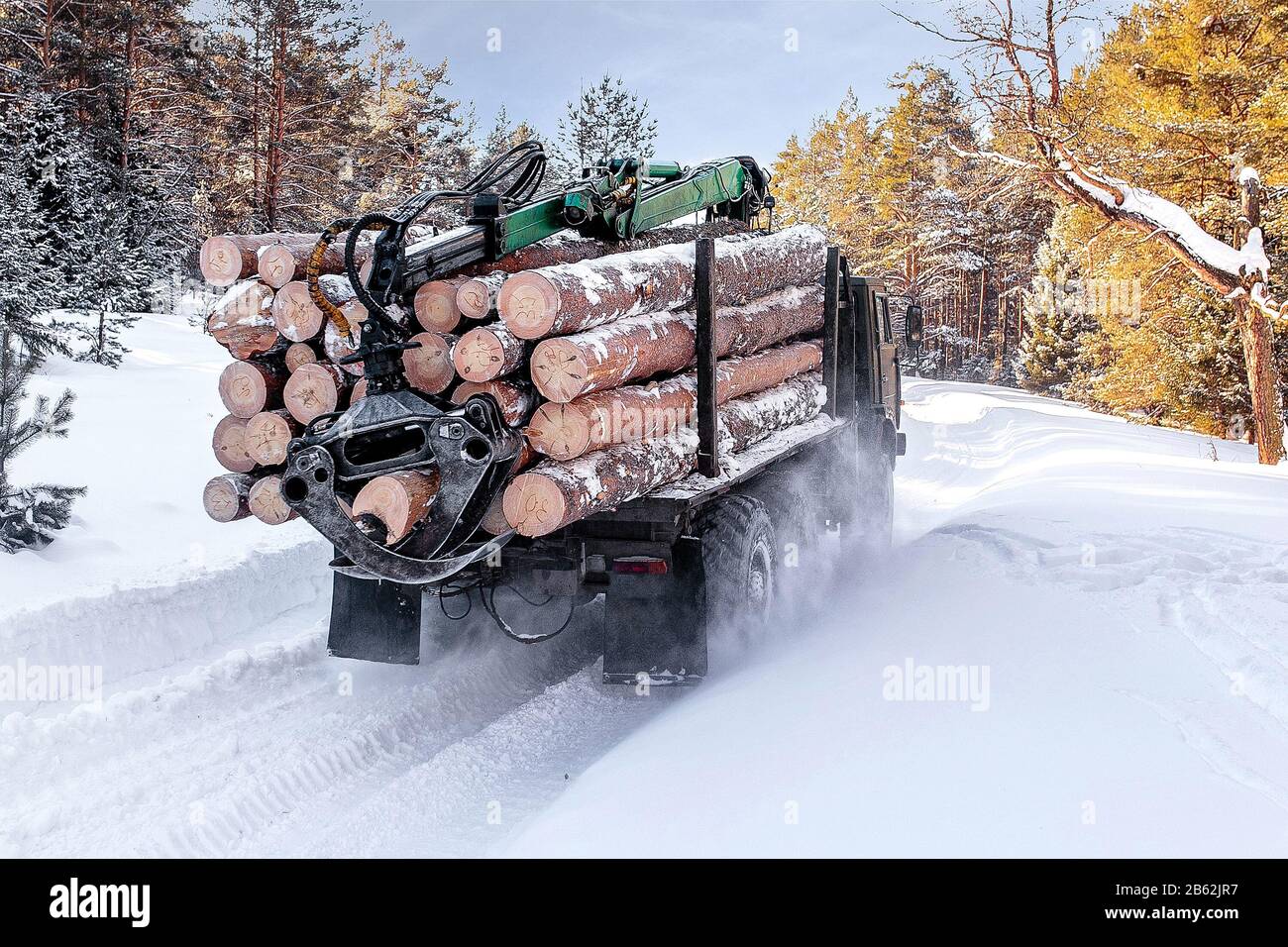 Timber driven board on winter road Stock Photo - Alamy