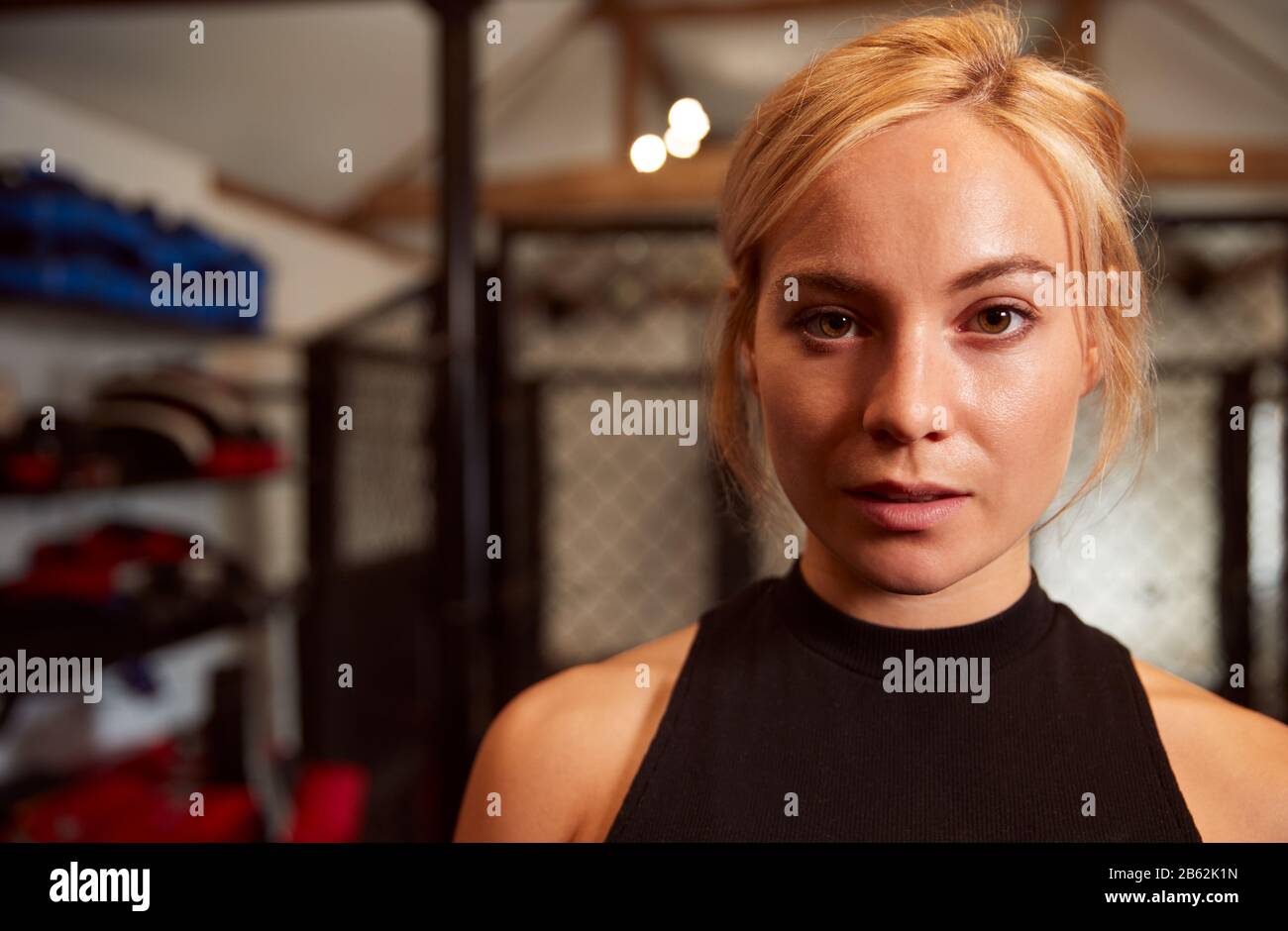 Portrait Of Female Mixed Martial Arts Fighter Training In Gym Stock