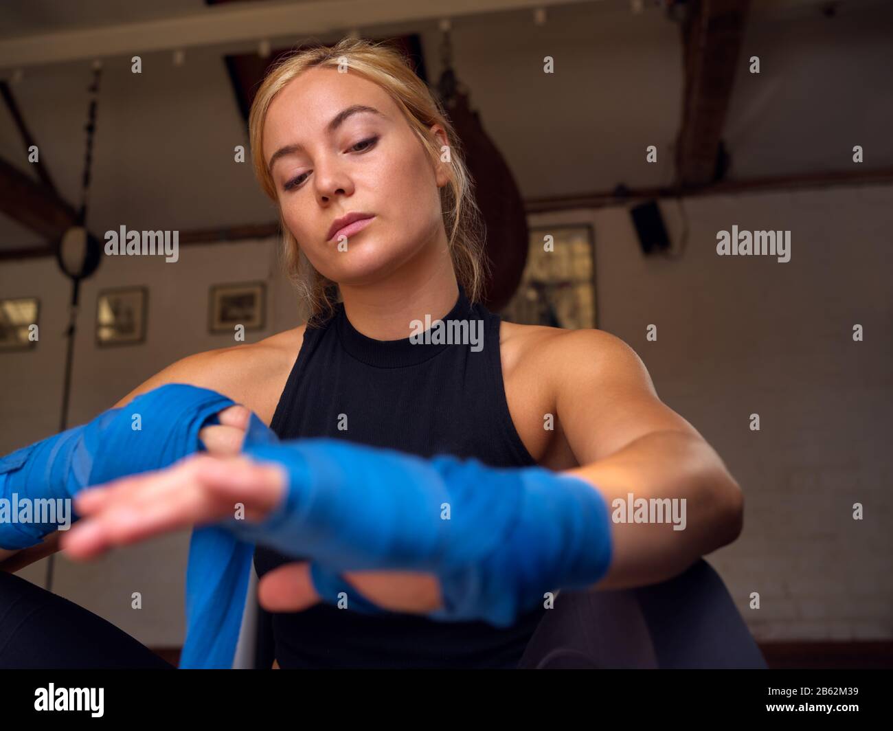 Woman putting on boxing hi-res stock photography and images - Alamy
