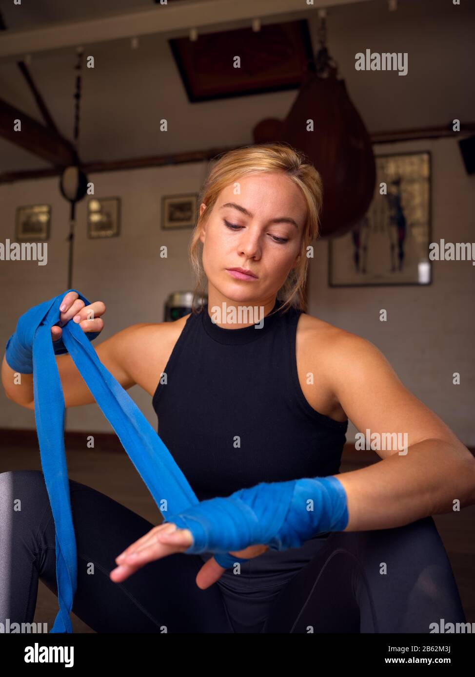 Woman putting on boxing hi-res stock photography and images - Alamy