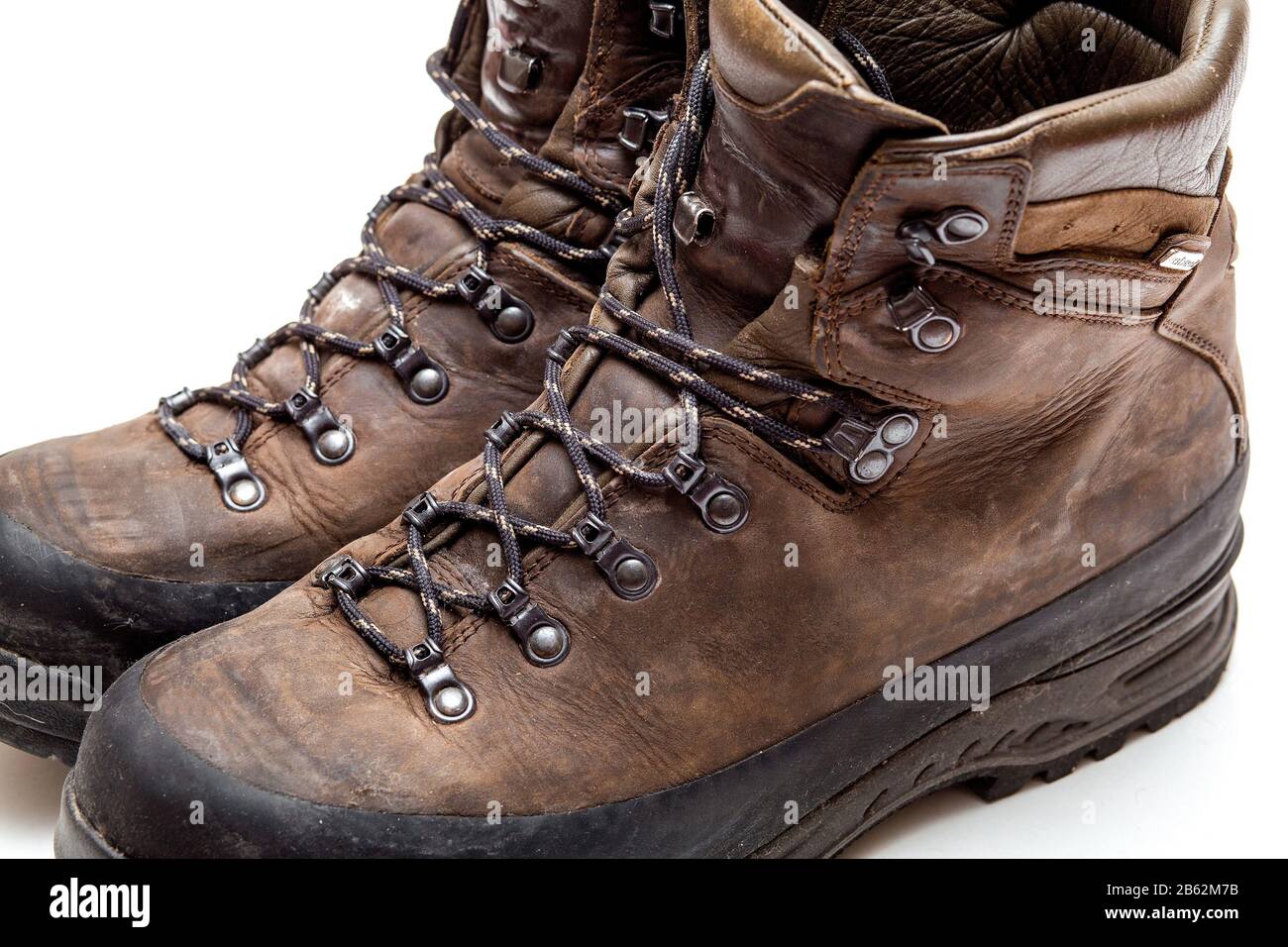 Old scuffed hiking boots isolated on white background Stock Photo - Alamy
