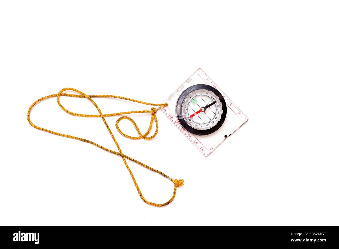 Transparent plastic compass on white background Stock Photo - Alamy