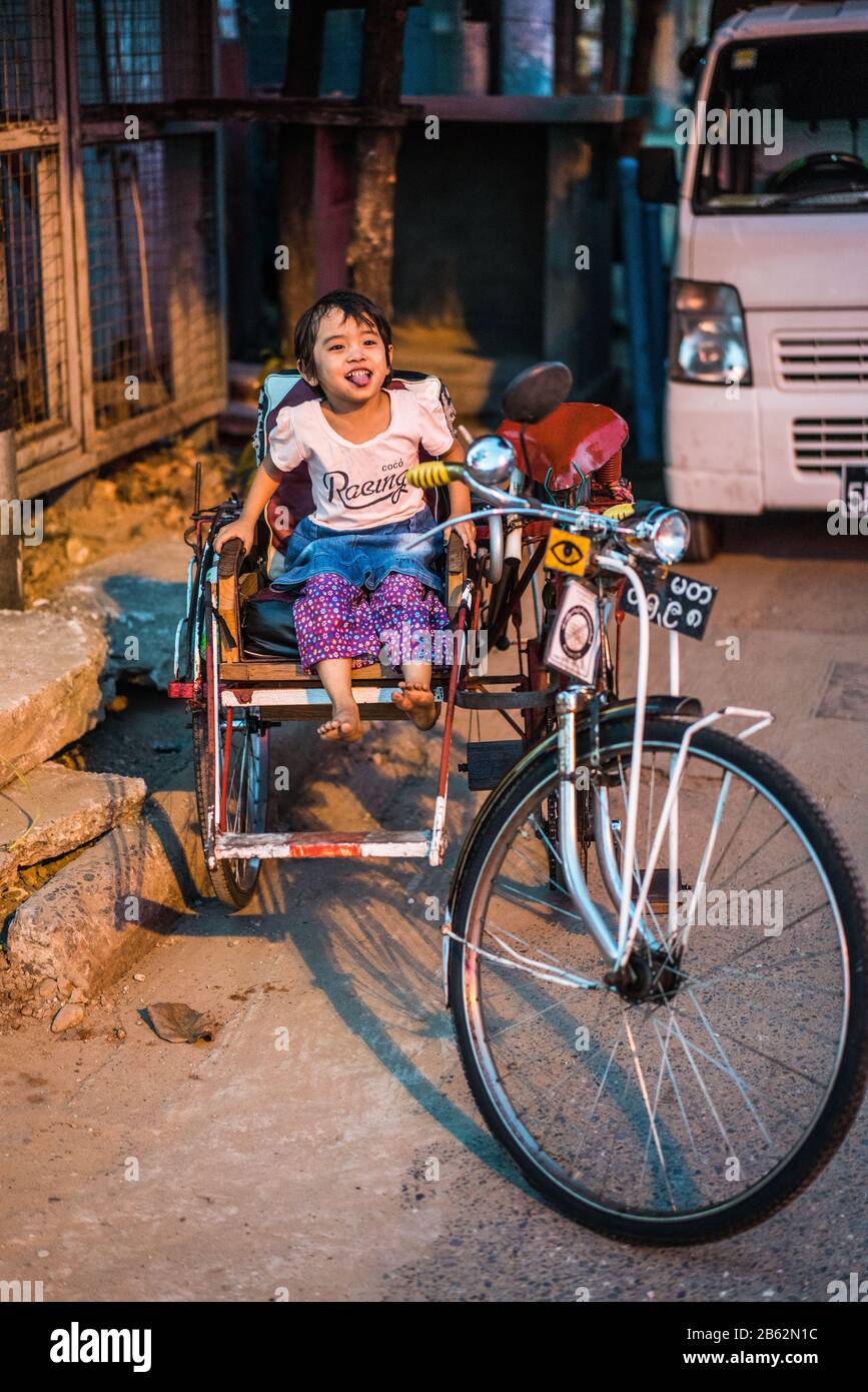 Girl on the rickshaw, Yangon, Myanmar, Asia Stock Photo - Alamy