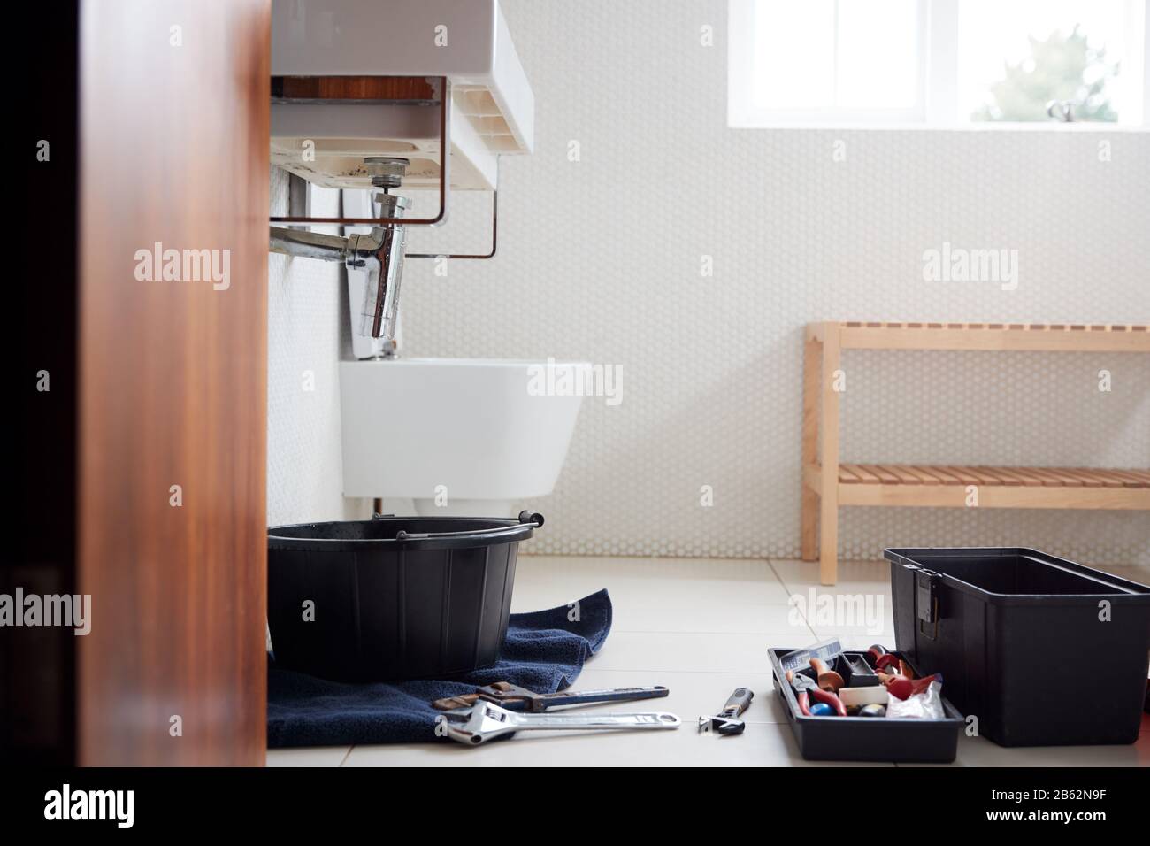 Plumbing Tools In Bathroom Ready To Repair Leaking Sink Stock Photo - Alamy