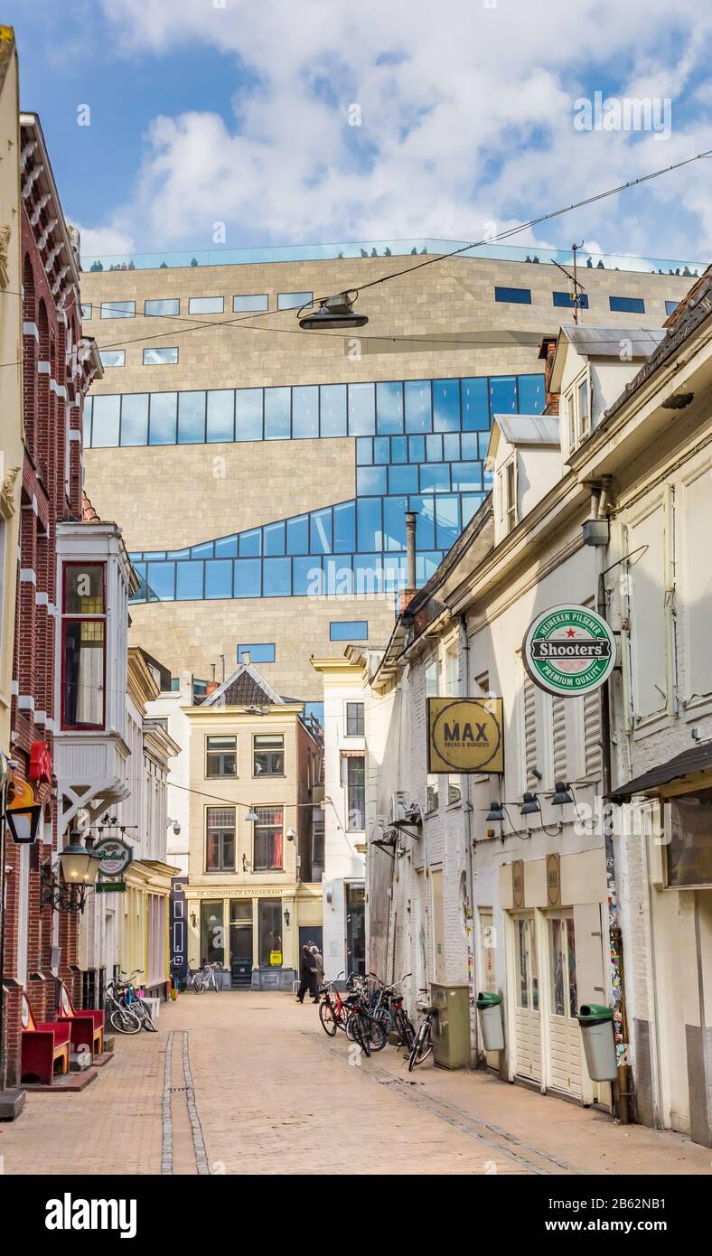 Historic street with bars and pubs leading to the Forum in Groningen ...