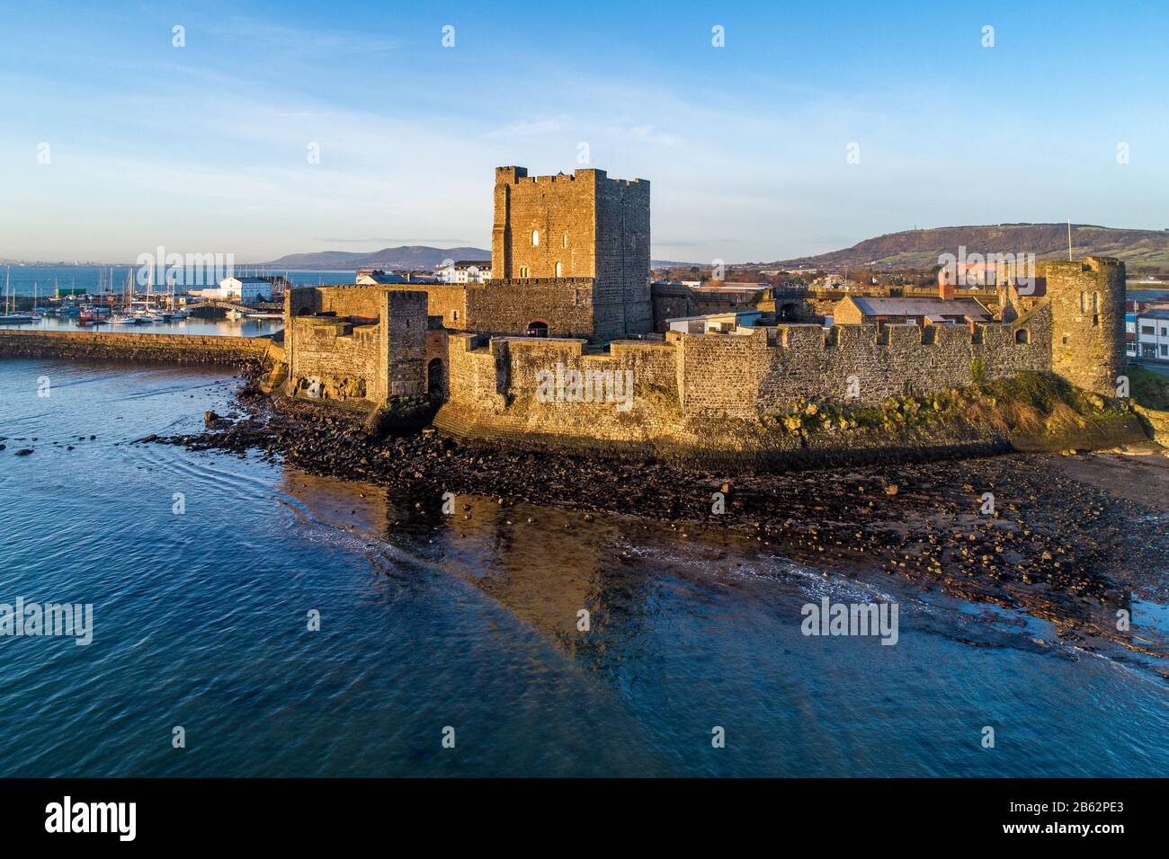 Medieval Norman Castle in Carrickfergus near Belfast in sunrise light ...