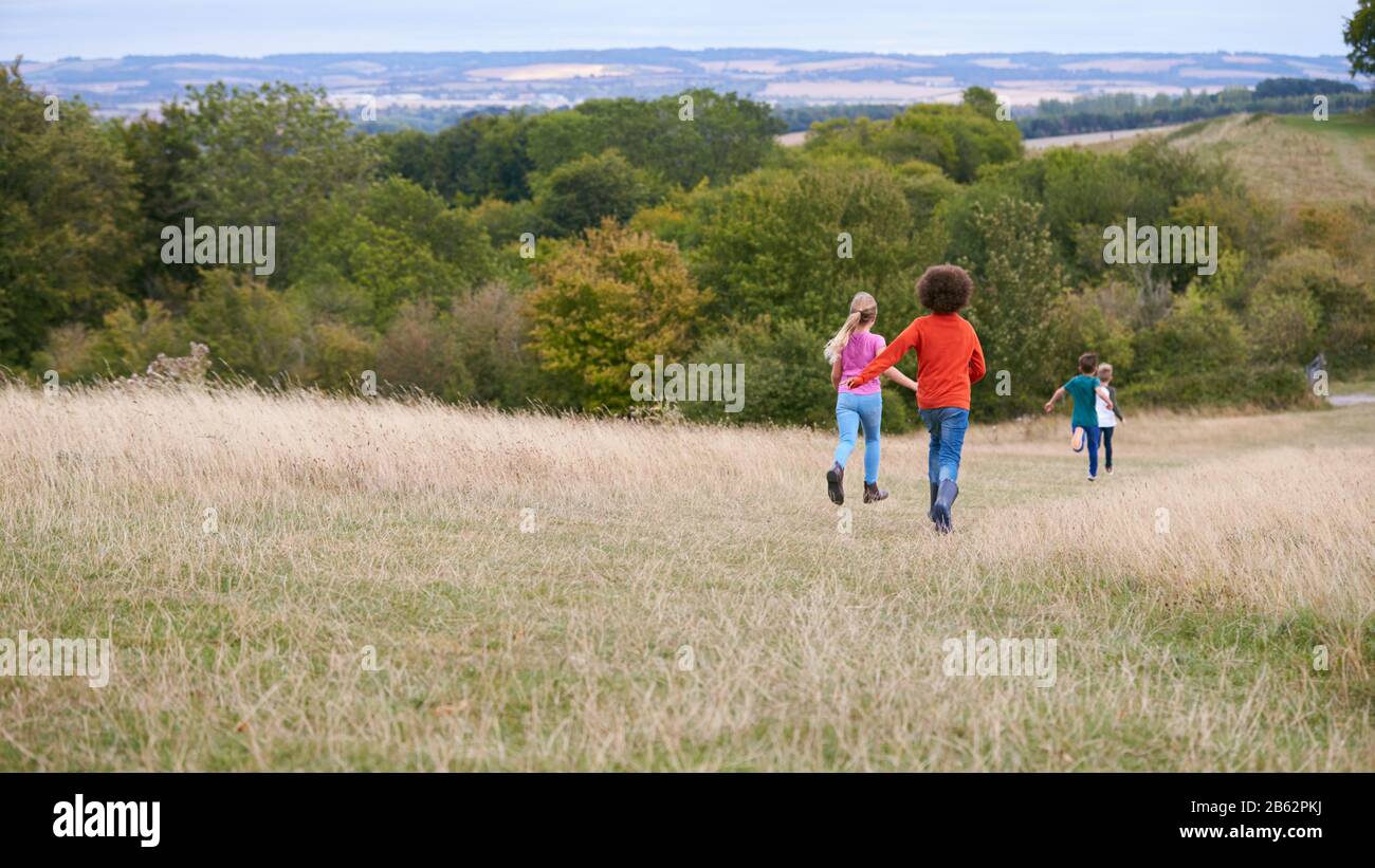 Group people running down hill hi-res stock photography and images - Alamy