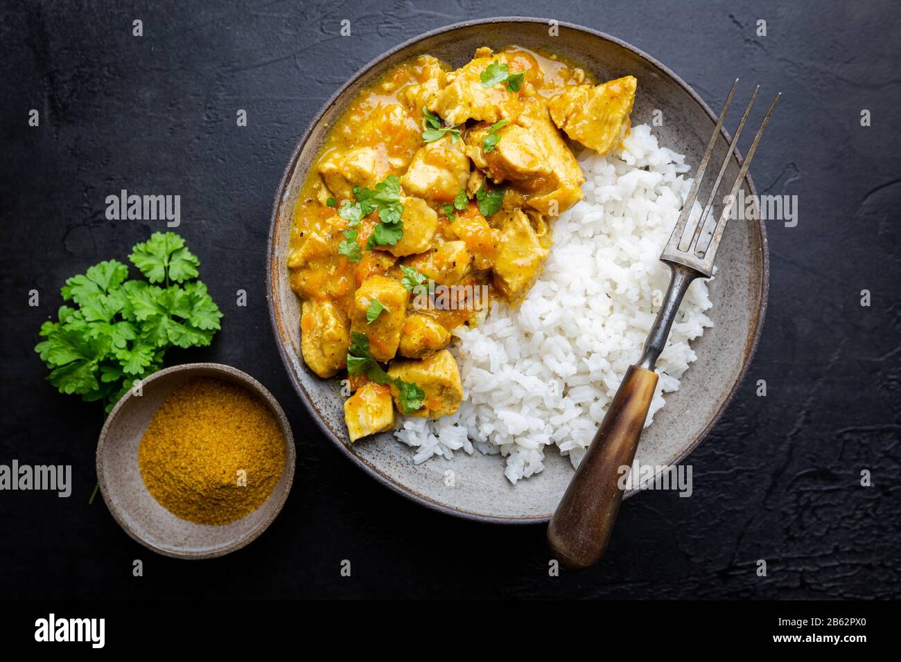 Spicy chicken cooked with curry sauce and rice, top view Stock Photo ...
