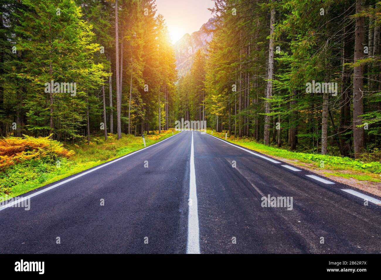 Mountain road. Landscape with rocks, sunny sky with clouds and ...