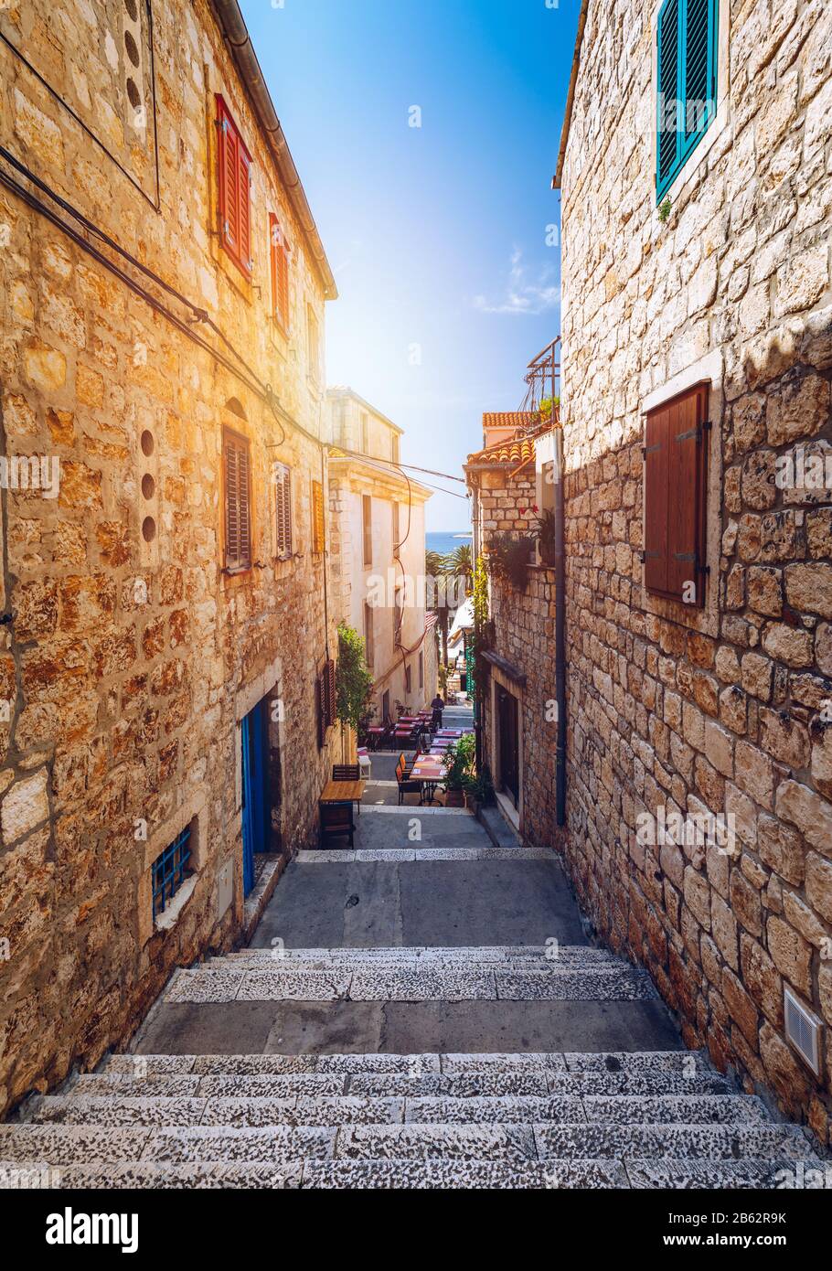Beautiful street with flowers in the Hvar town, Hvar island, Dalmatia ...
