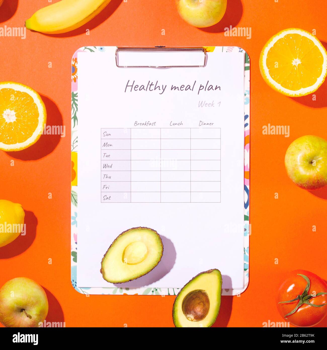 Healthy weekly meal plan among fresh organic fruits and vegetables ...