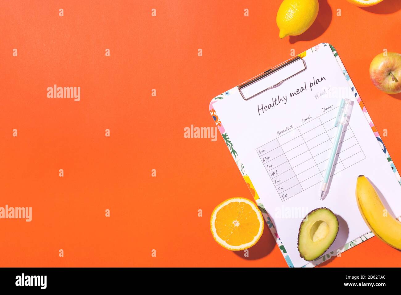 Healthy weekly meal plan among fresh organic fruits and vegetables ...