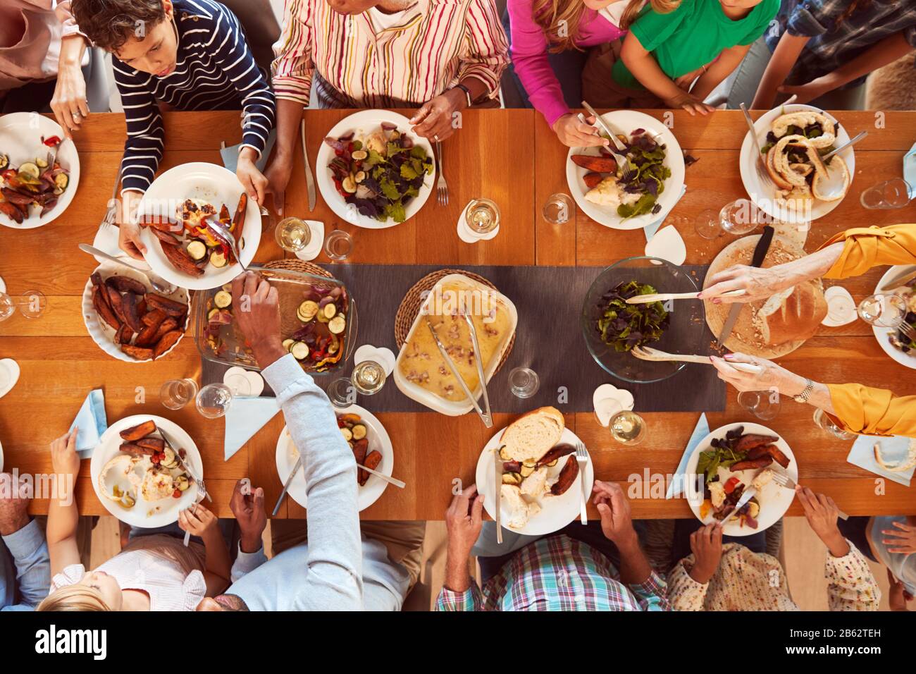 Family table eating from above children hi-res stock photography and ...