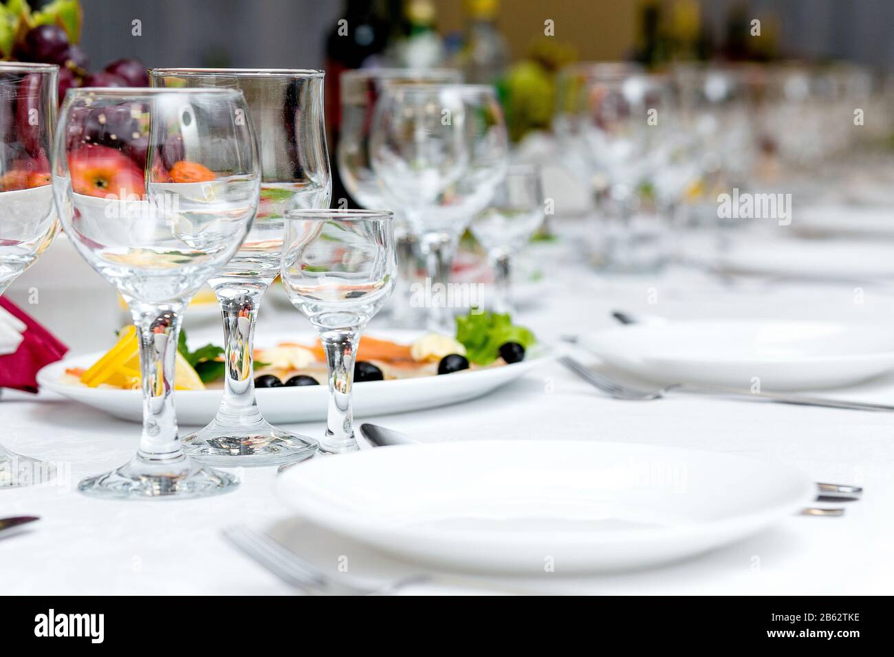 Banquet table decorated with glasses Stock Photo - Alamy