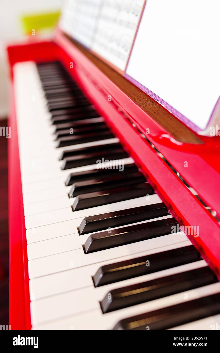 Red piano with keys close-up with musical notes, nobody Stock Photo - Alamy