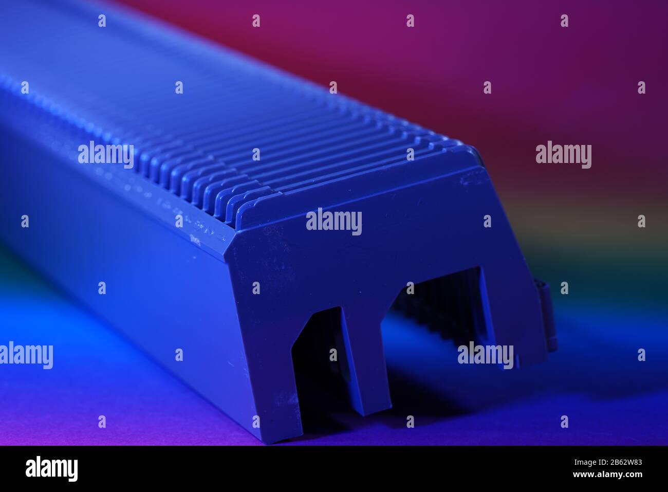 Old slide projector with slide frame photographed in the studio with ...