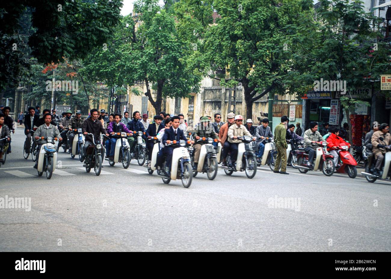 Moped riders on the street, Hanoi, Vietnam, November 1995 Stock Photo ...