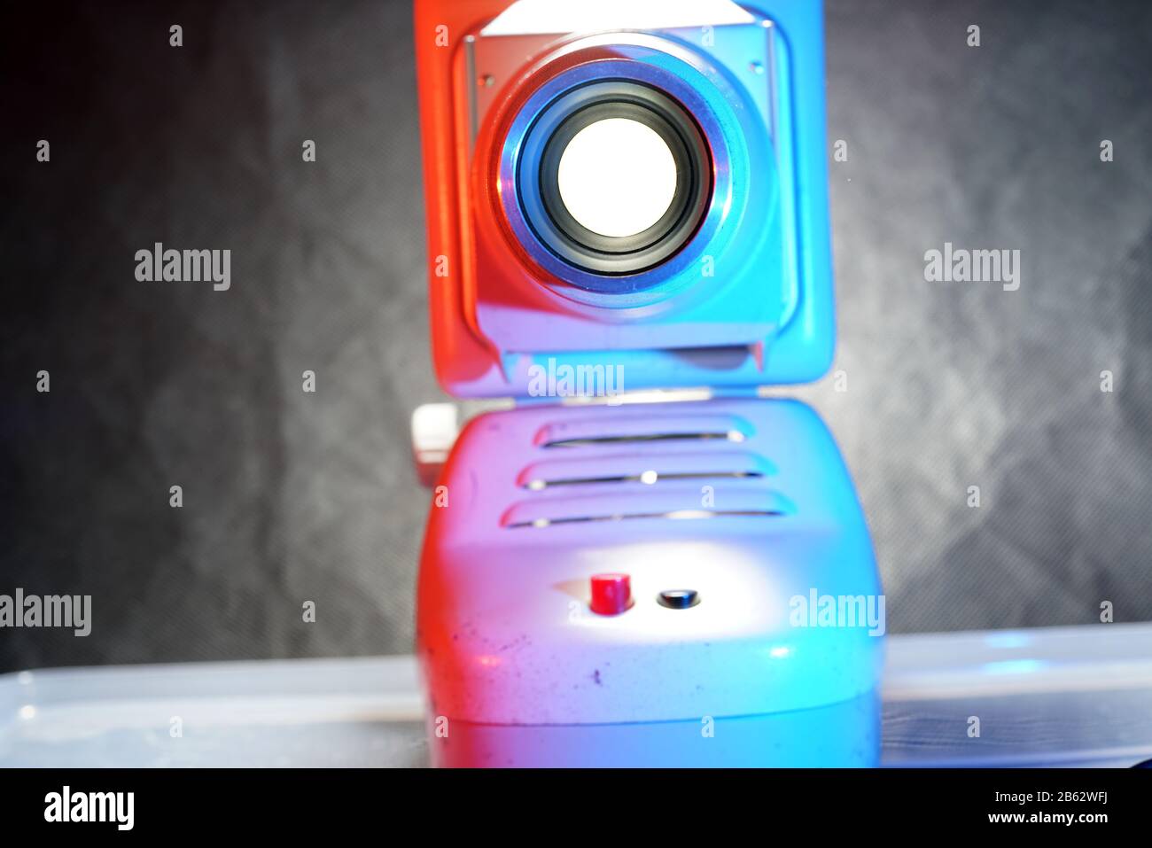 Old slide projector with slide frame photographed in the studio with ...