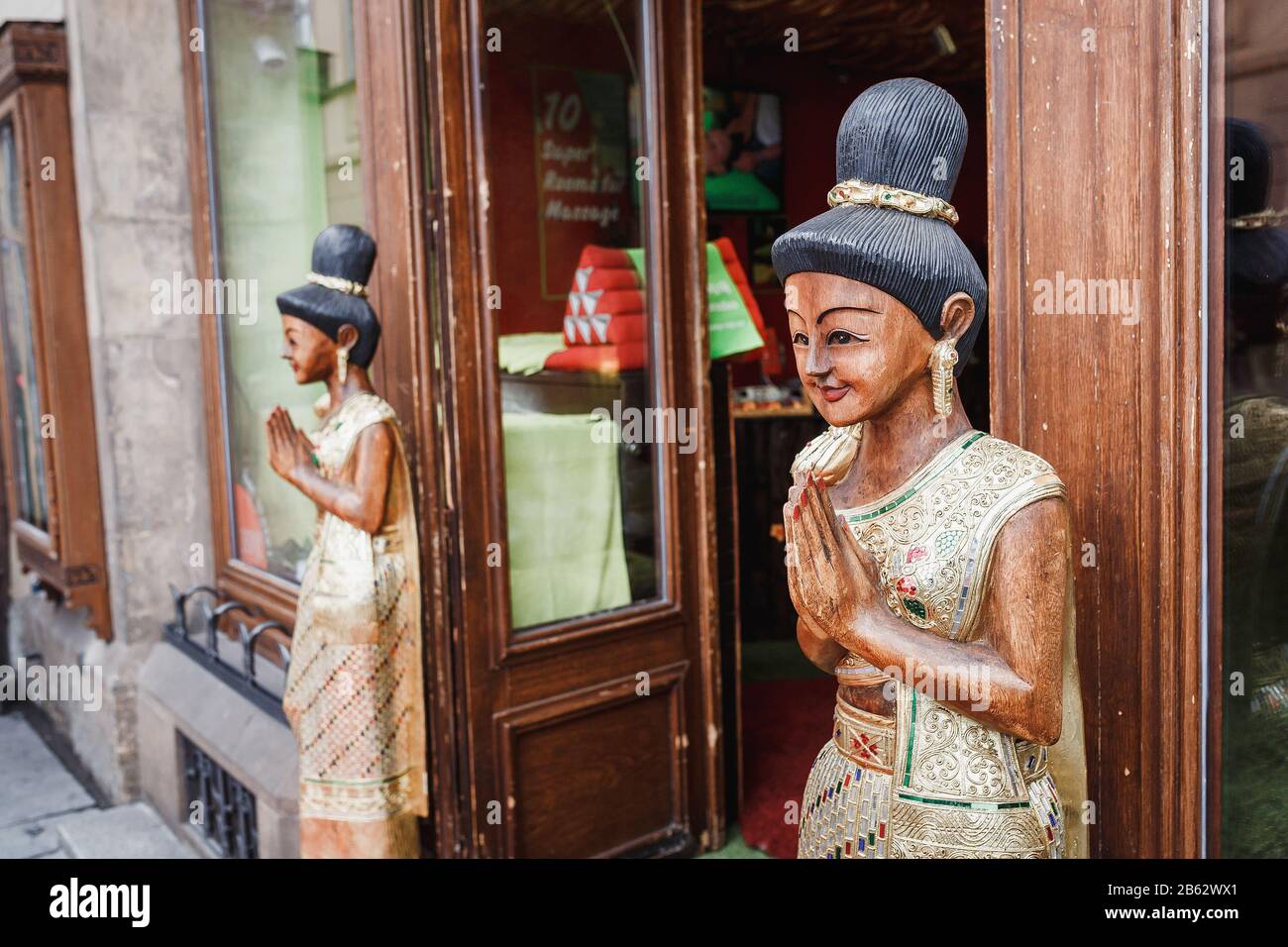 Entrance to a colorful Thai gift shop and massage parlor decorated with ...
