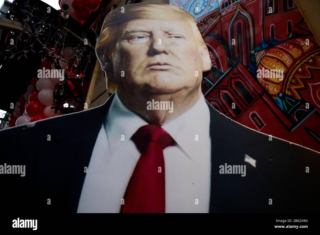 The full-length portrait of Donald Trump is installed near an entrance ...