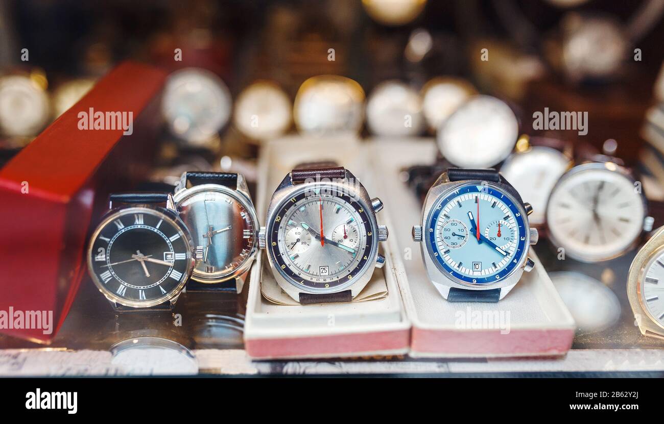 Men wrist watches in a showcase of a luxury store Stock Photo - Alamy