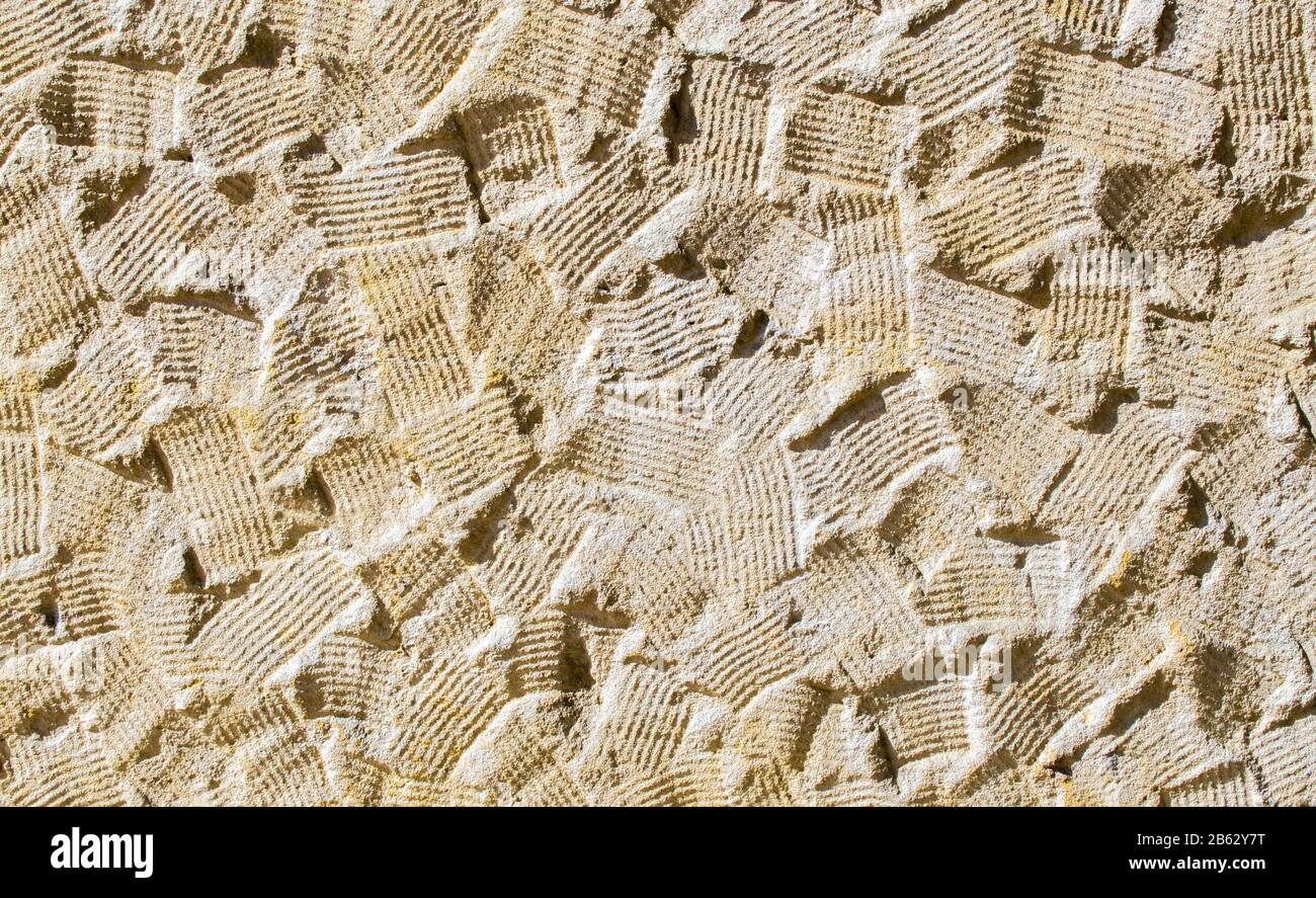 background texture-sandstone brush stroke pattern on an exterior wall ...
