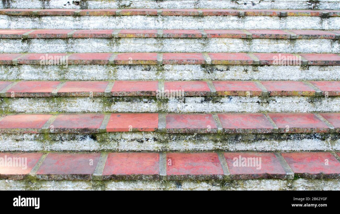 background wallpaper-close up of weathered red adobe tile stairs in ...