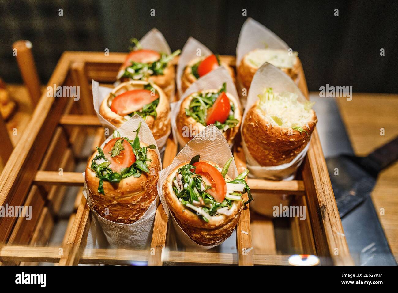 Bread roll with greens, tomato at snack store Stock Photo - Alamy