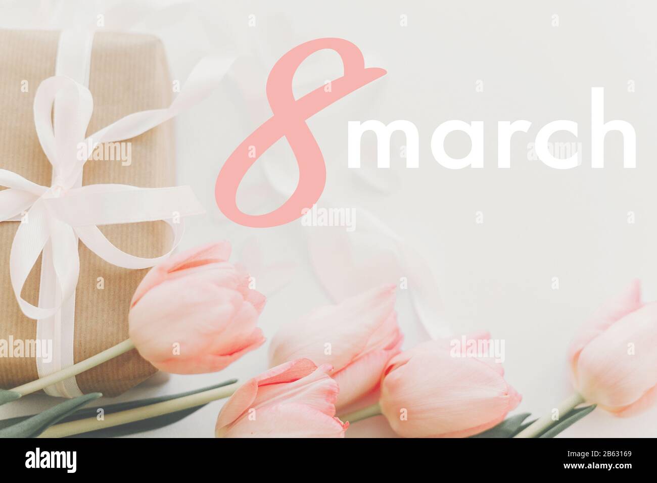 8 march. Happy womens day greeting card. 8 march text on pink tulips ...