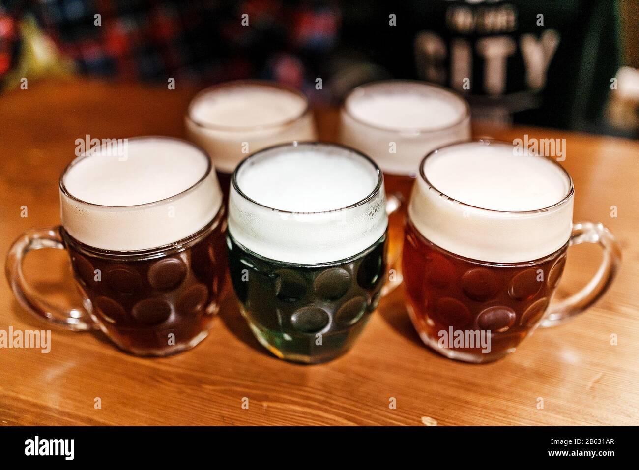 Five authentic crafted mugs of Czech beer in the Prague pub on the ...