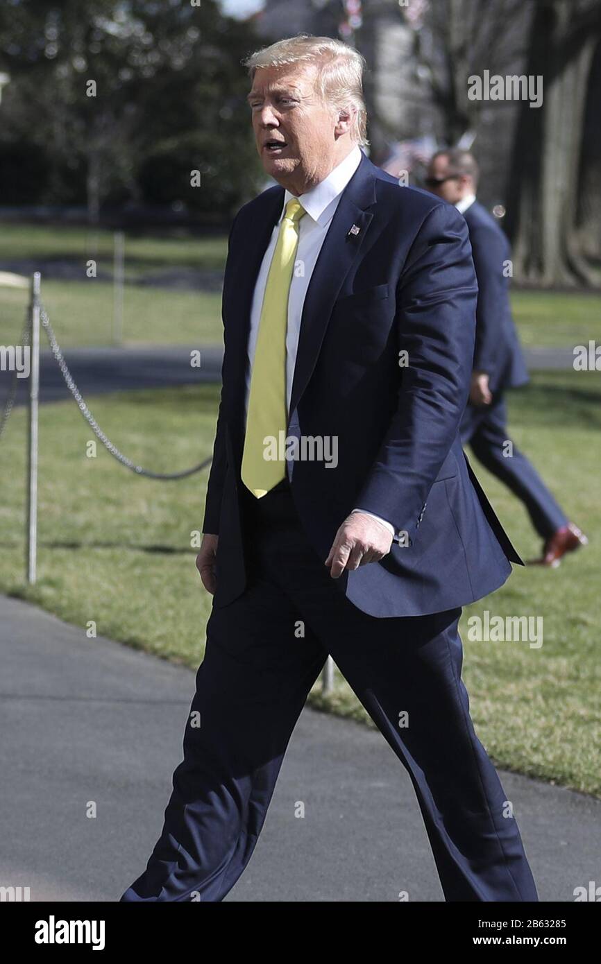 Washington, United States. 09th Mar, 2020. President Donald Trump walks ...
