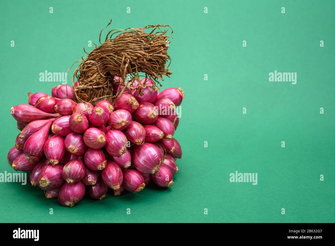 Bunch of high quality small red shallot sambar onions from India on ...